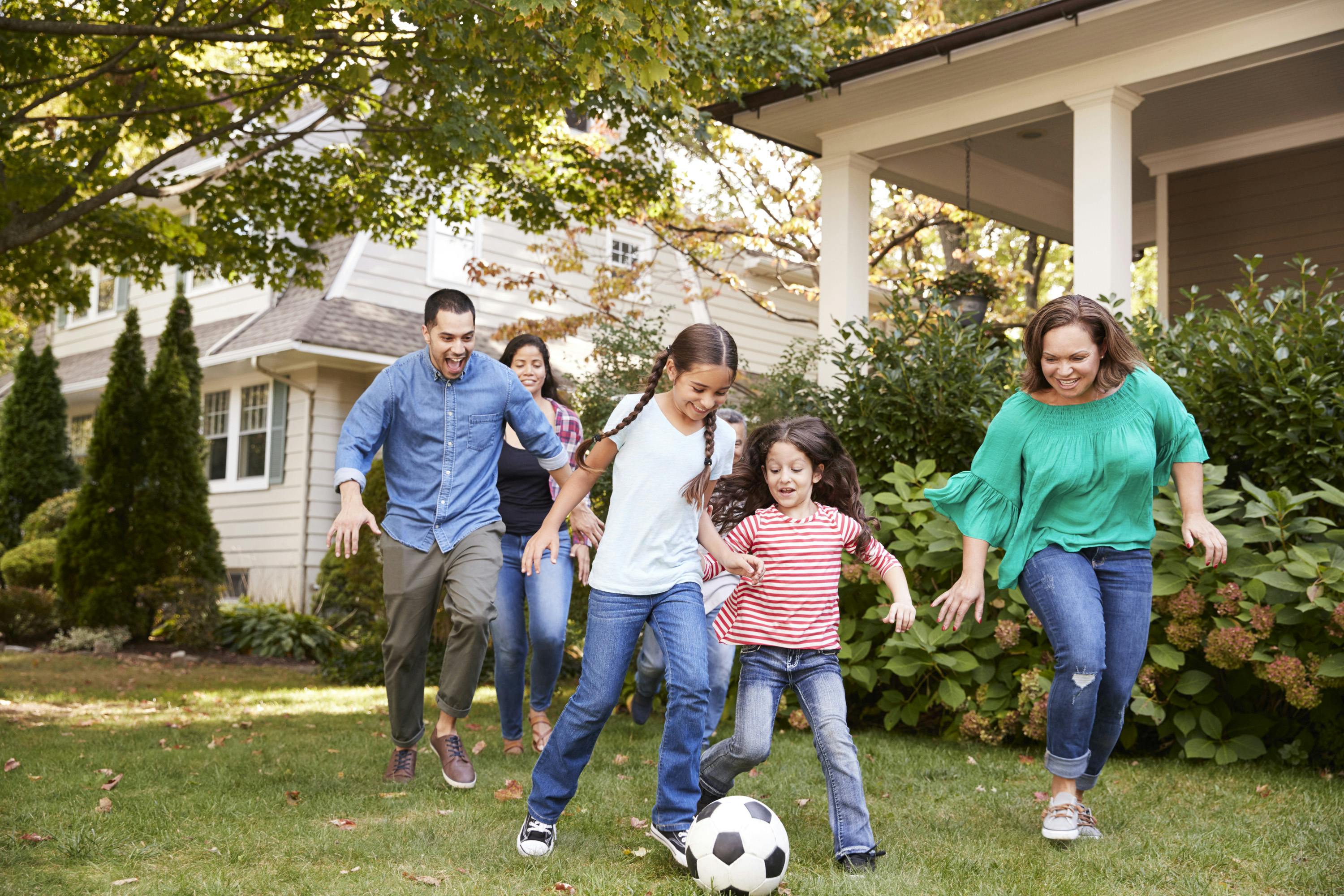 Hispanic Family Playing Soccer